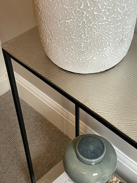 Suhani Black textured Metal Frame and Nickel Topped Shelved Console – Abode